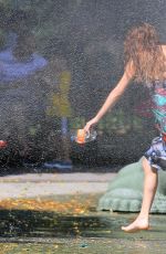SELENA GOMEZ Running Thru Sprinklers at Water Playground in Brooklyn 06 ...