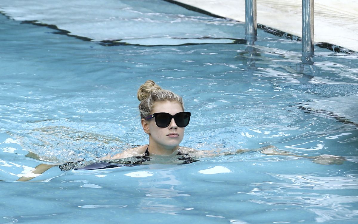 CHARLOTTE MCKINNEY in Bikini at a Pool in Miami 02/18/2017 – HawtCelebs