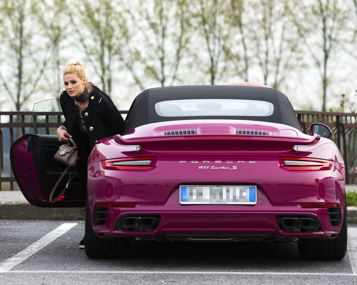 MICHELLE HUNZIKER Driving Her New Porsche Out in Milan 03/24/2017 ...