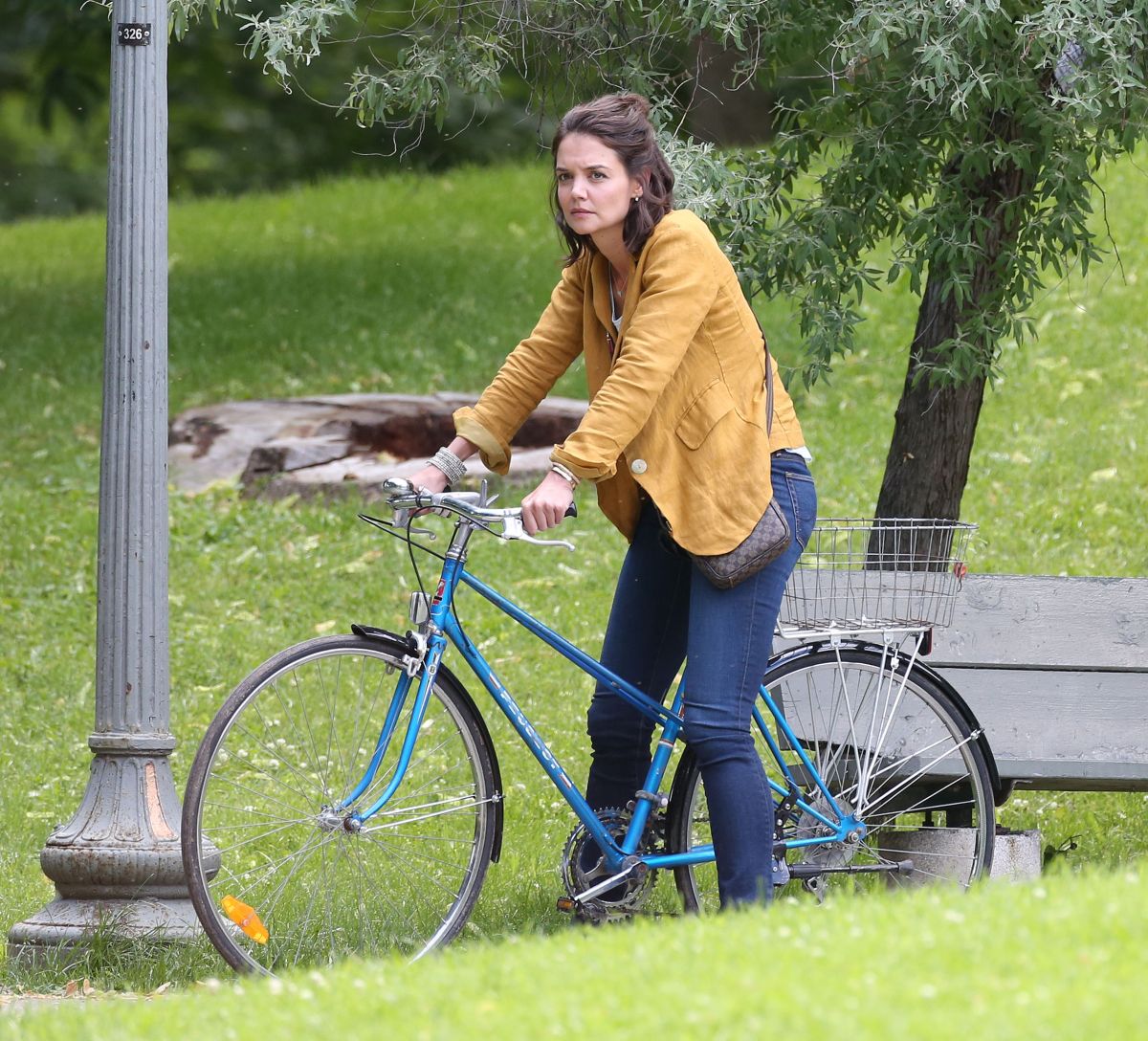 KATIE HOLMES Riding a Bike on the Set of The Gift in Montreal 06/22 ...