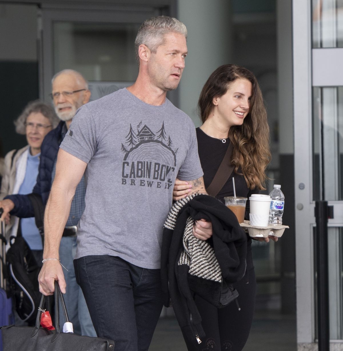 LANA DEL REY and Sean Larkin at JFK Airport in New York 10/25/2019 ...