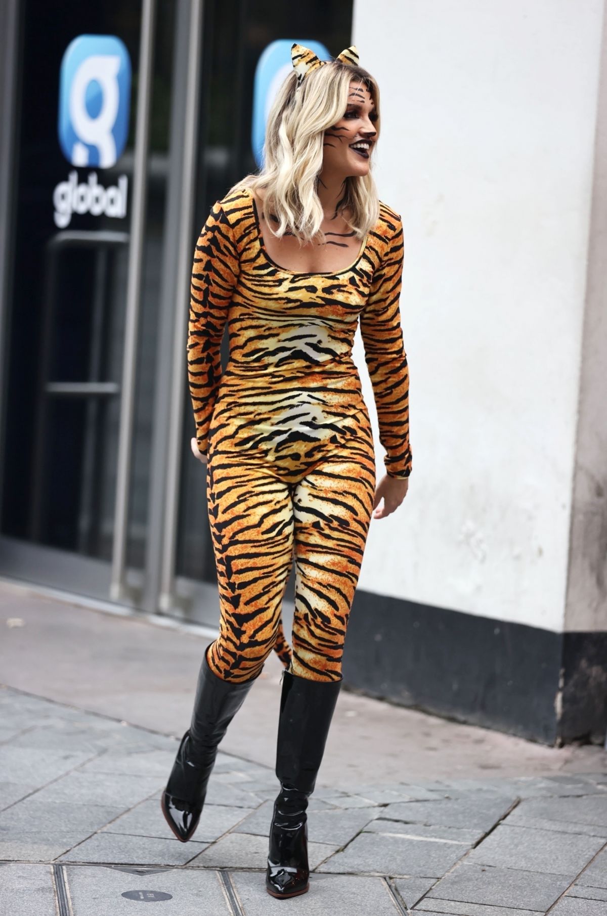 ASHLEY ROBERTS in a Tiger Print Catsuit Leaves Heart Radio in London 10 ...