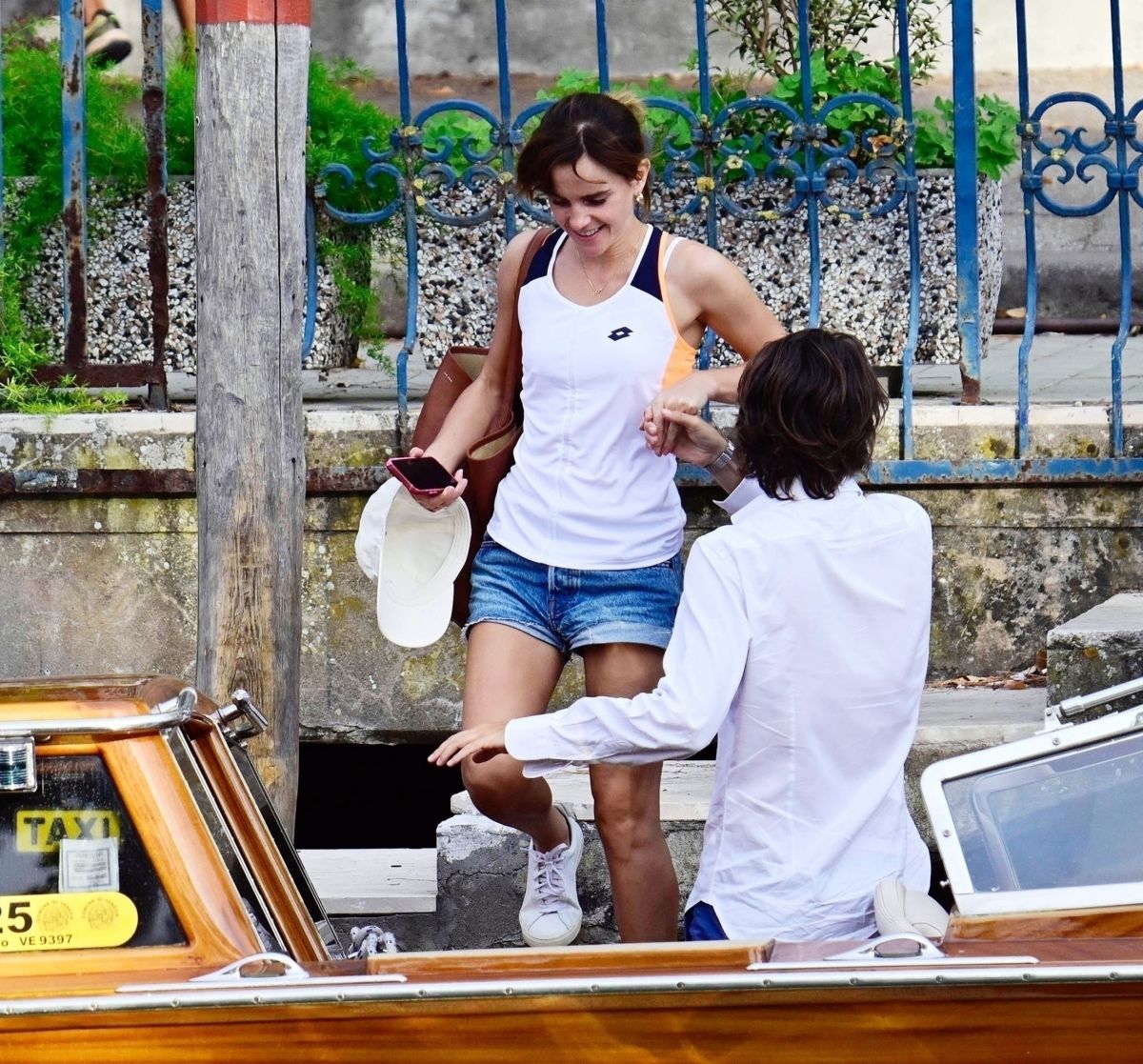 EMMA WATSON in Senim Shorts Catching a Water Taxi in Venice 08/30/2022 ...