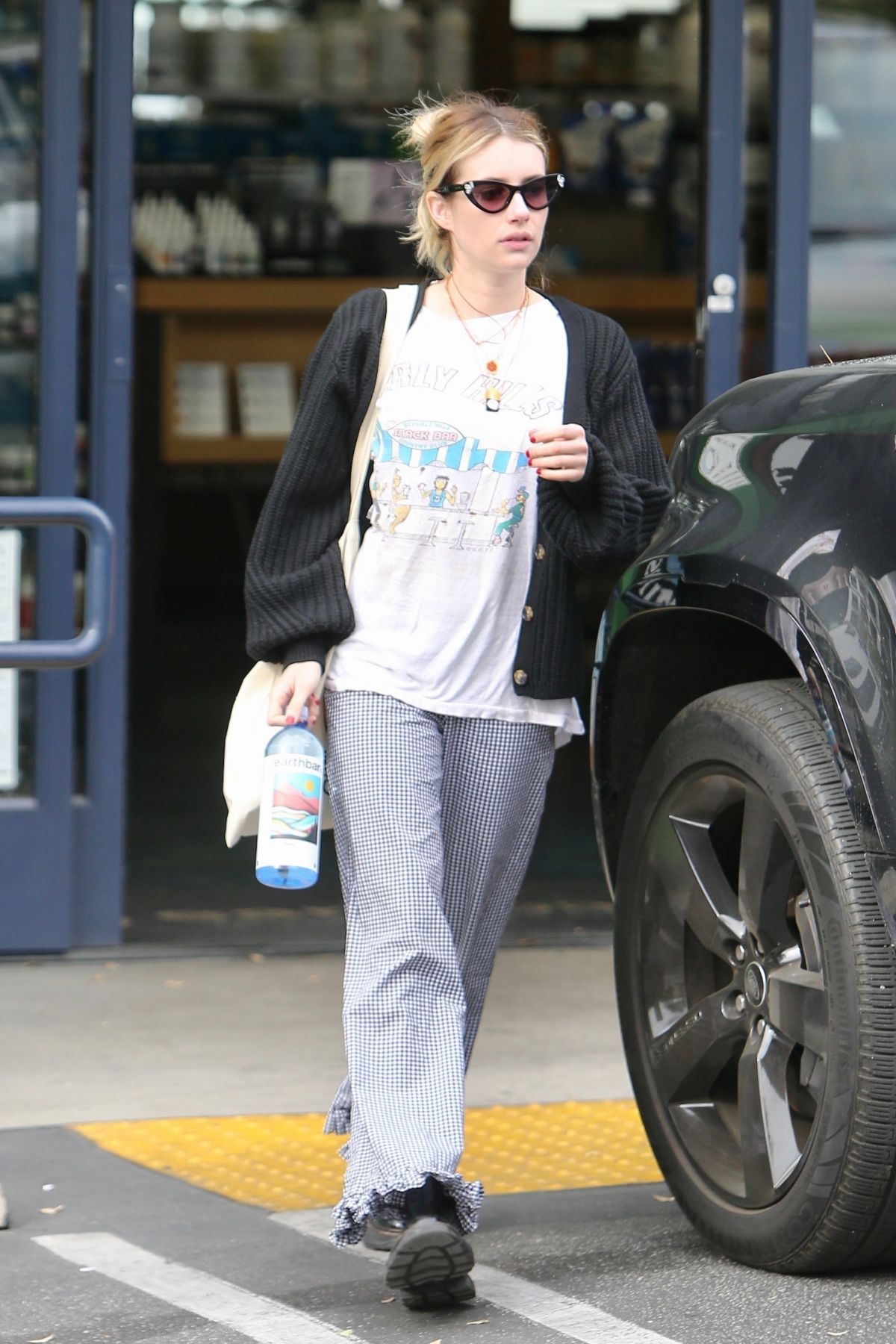 EMMA ROBERTS Shopping for Health Supplements at Earth Bar in West ...