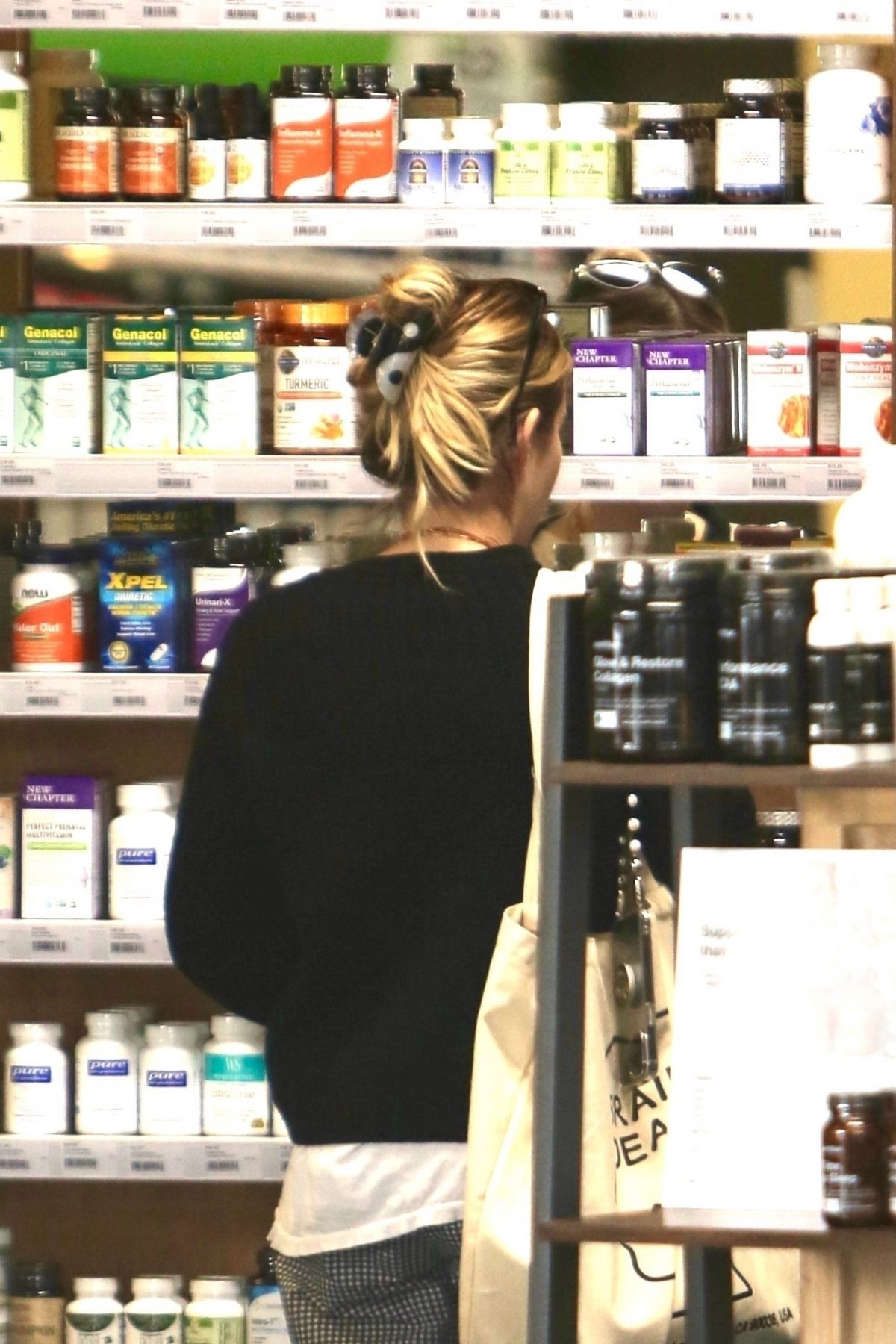EMMA ROBERTS Shopping for Health Supplements at Earth Bar in West ...