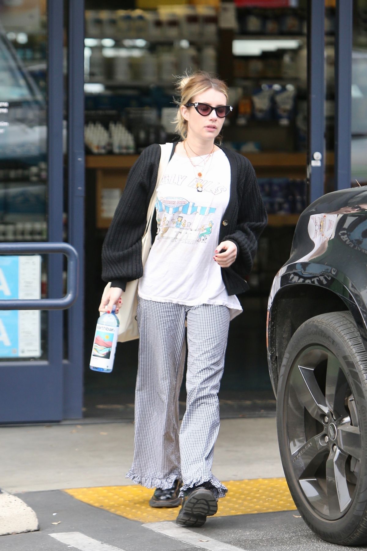 EMMA ROBERTS Shopping for Health Supplements at Earth Bar in West ...