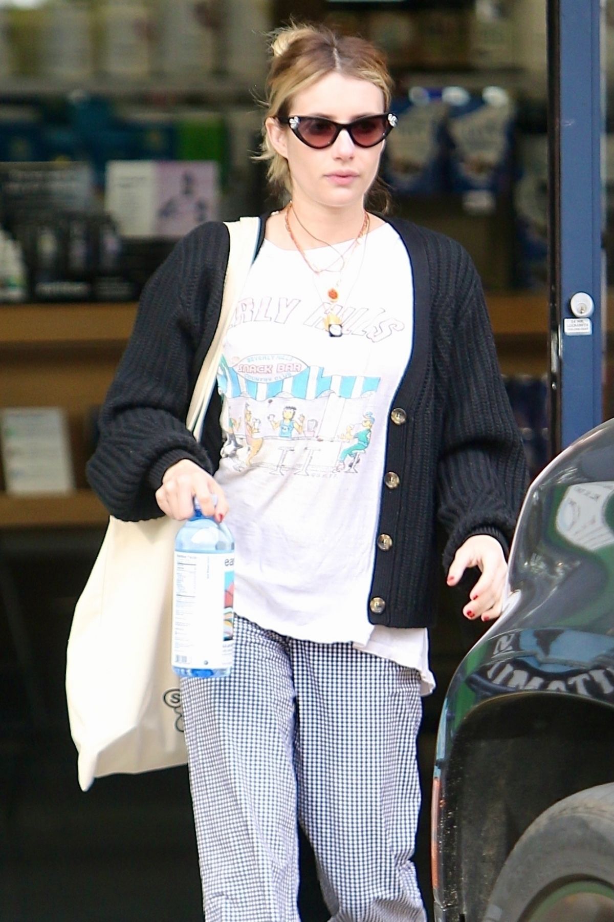 EMMA ROBERTS Shopping for Health Supplements at Earth Bar in West ...