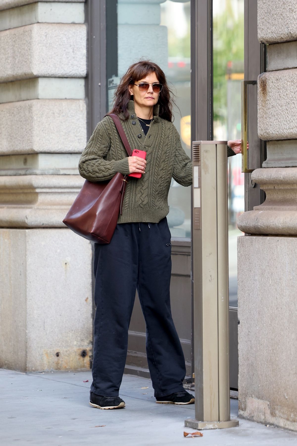 KATIE HOLMES Arrives at an Office Building in New York 10/25/2023 ...