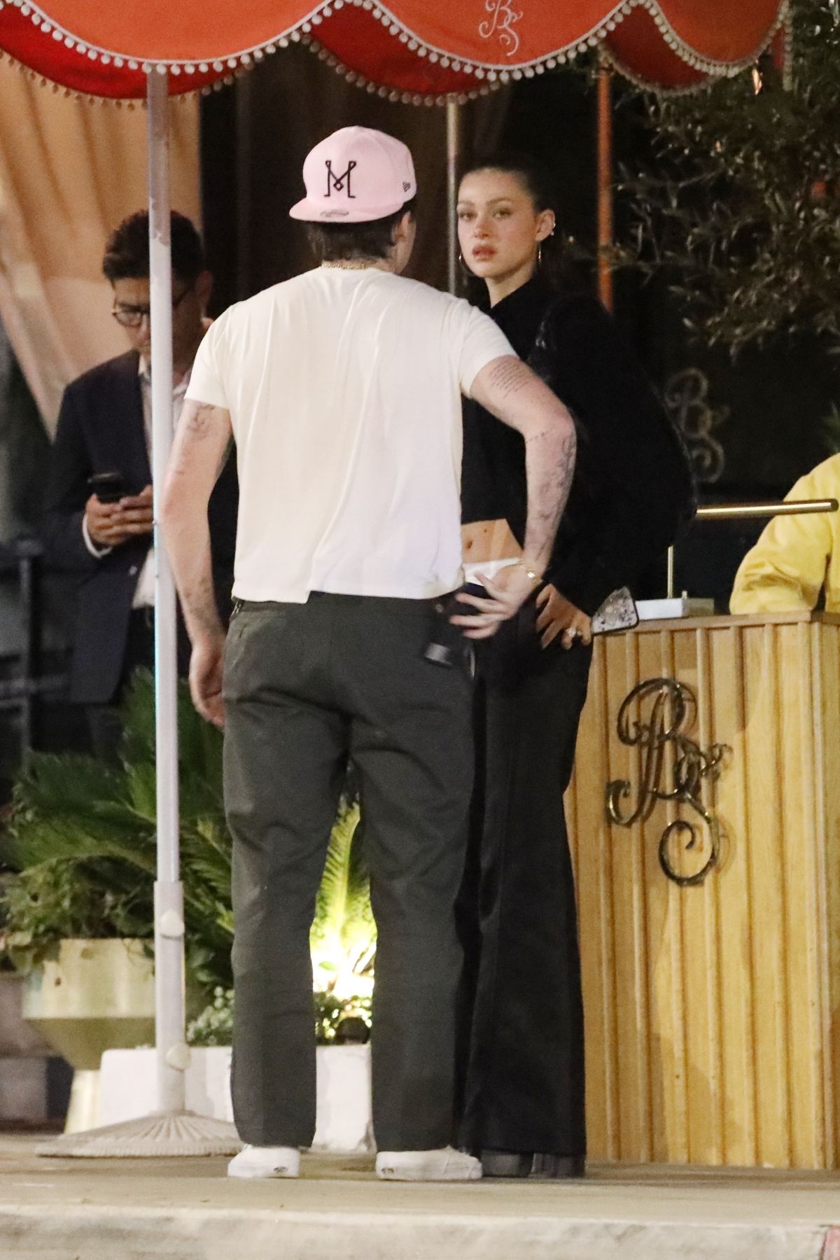 NICOLA PELTZ and Brooklyn Beckham Leavies The Bird Streets Club in West ...