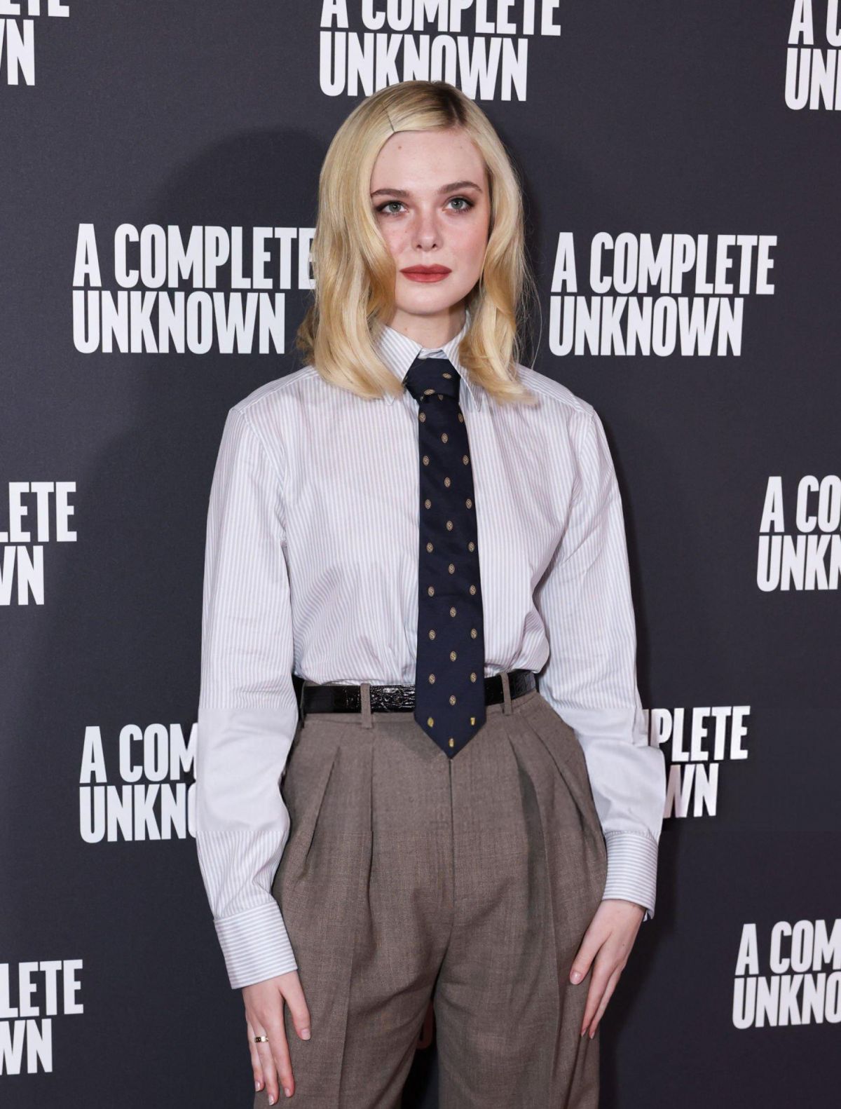 ELLE FANNING at A Complete Unknown Photocall in London 12/16/2024 ...