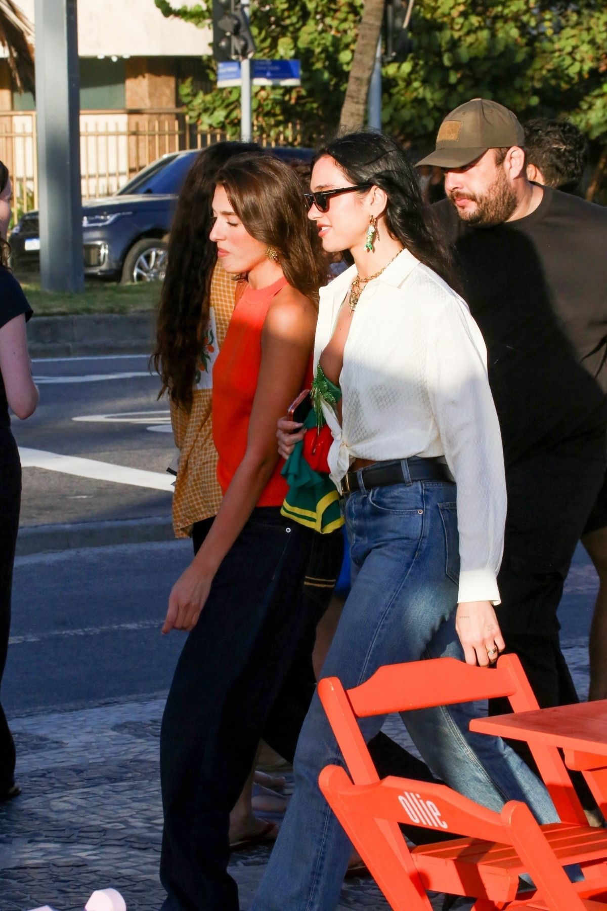 DUA LIPA Enjoys a Drink with Family on Ipanema Beach in Rio De Janeiro ...
