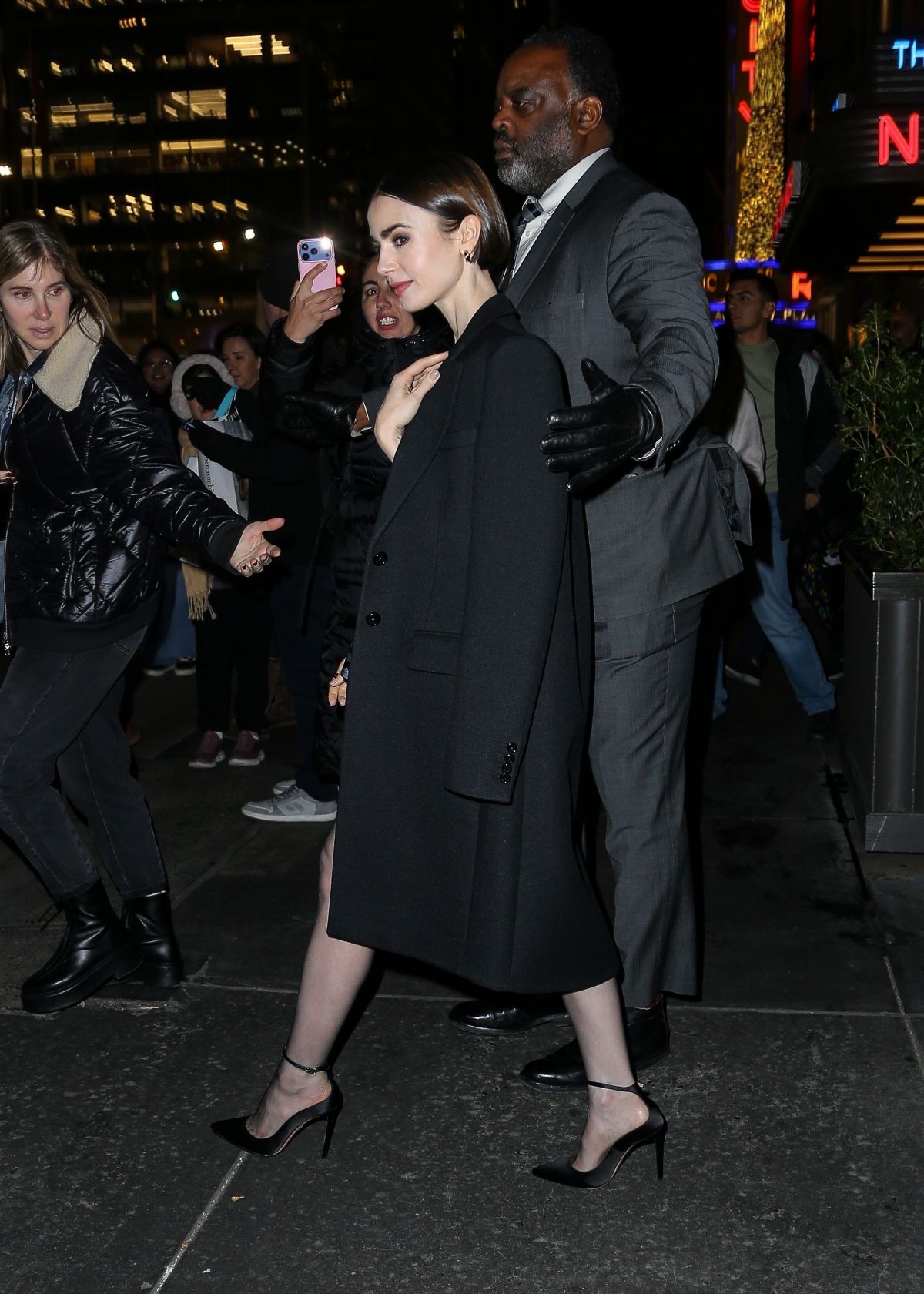 LILY COLLINS Leaves Tonight Show Studios in New York City 12/09/2025 ...