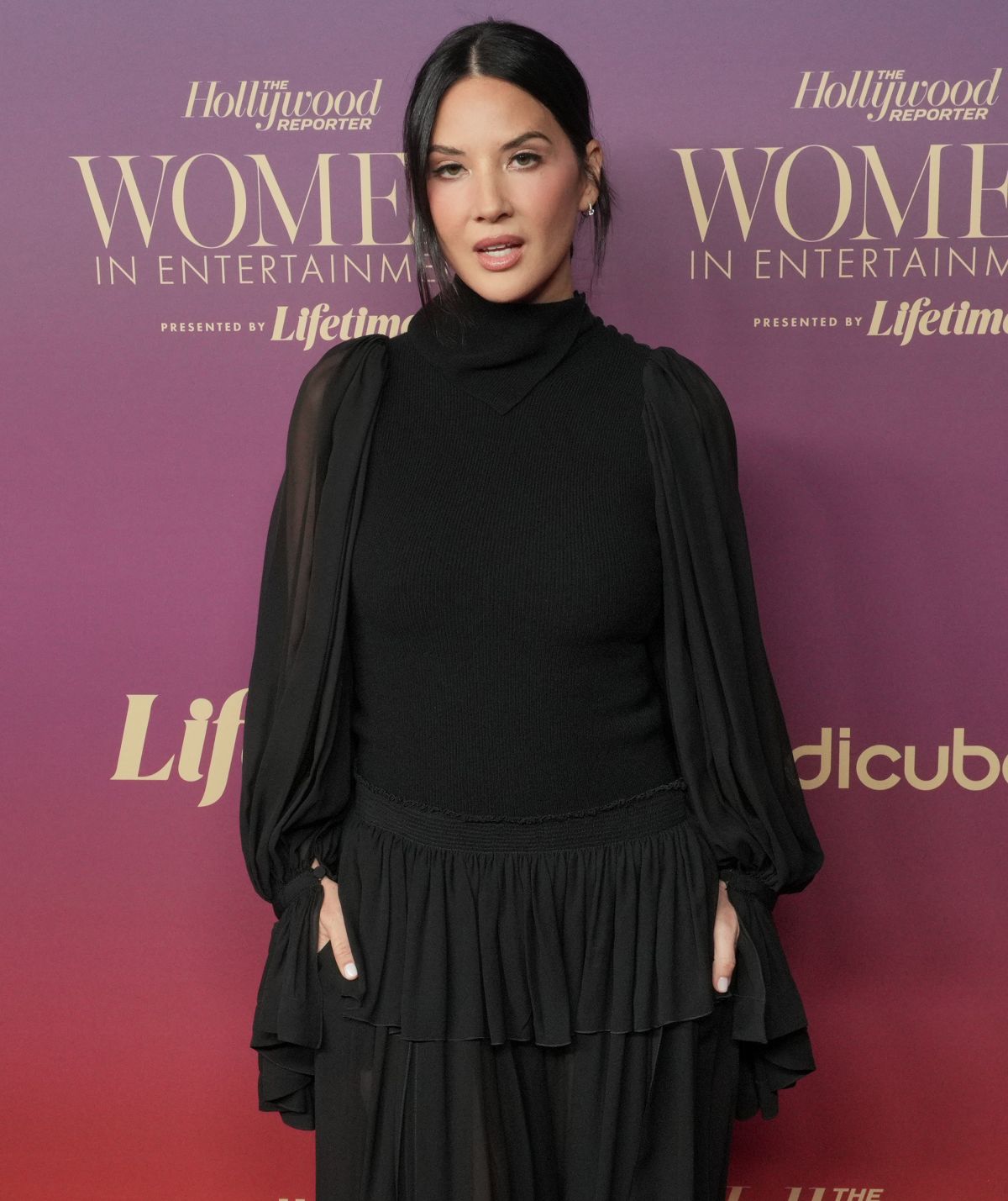 OLIVIA MUNN at The Hollywood Reporter’s Annual Women in Entertainment ...