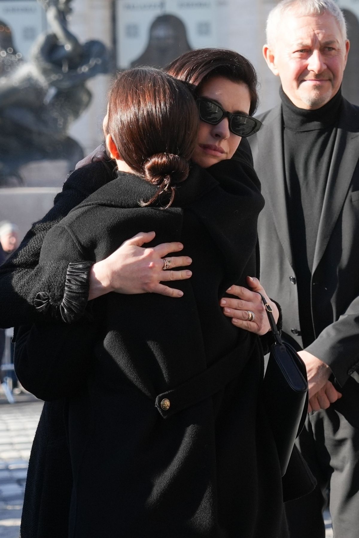 ANNE HATHAWAY at Funeral of Valentino Garavani at Basilica di Santa ...