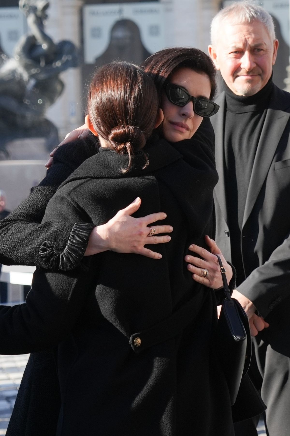 ANNE HATHAWAY at Funeral of Valentino Garavani at Basilica di Santa ...