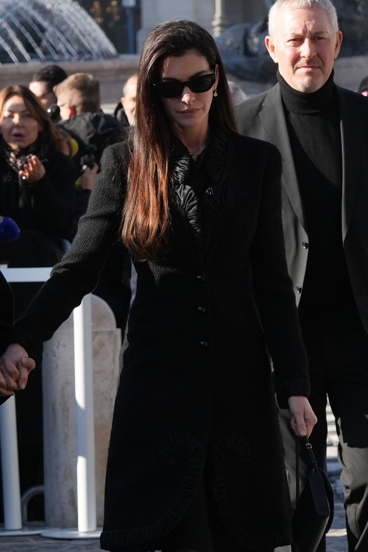 ANNE HATHAWAY at Funeral of Valentino Garavani at Basilica di Santa ...